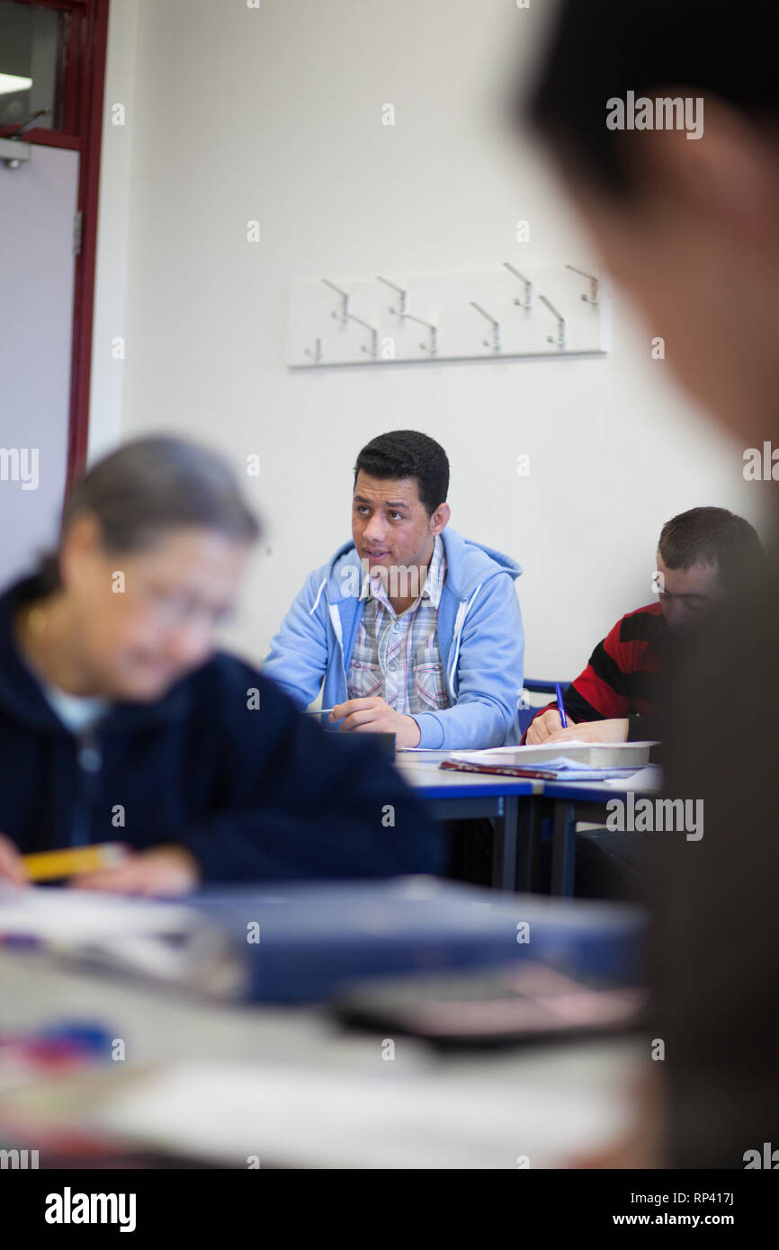 men in a classroom studying ESOL, English for speakers of other ...