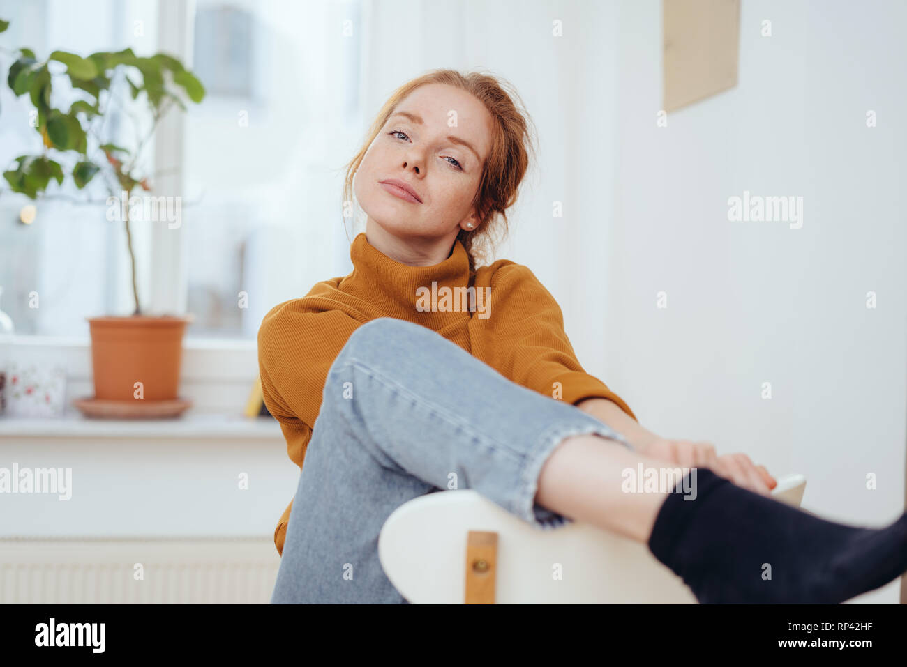 Beautiful woman backwards on chair hi-res stock photography and images ...