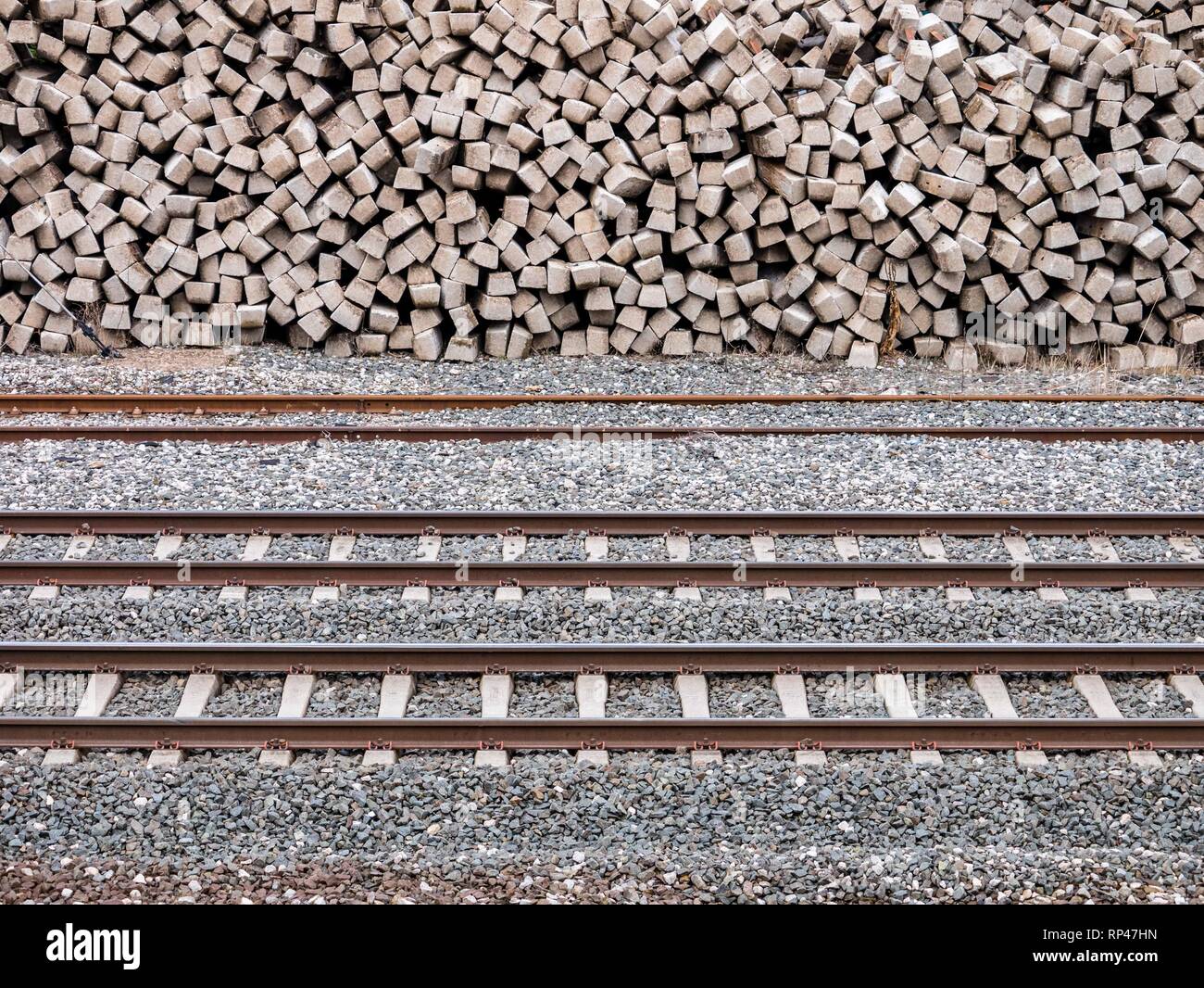 Rail tracks and piled railroad ties Stock Photo - Alamy