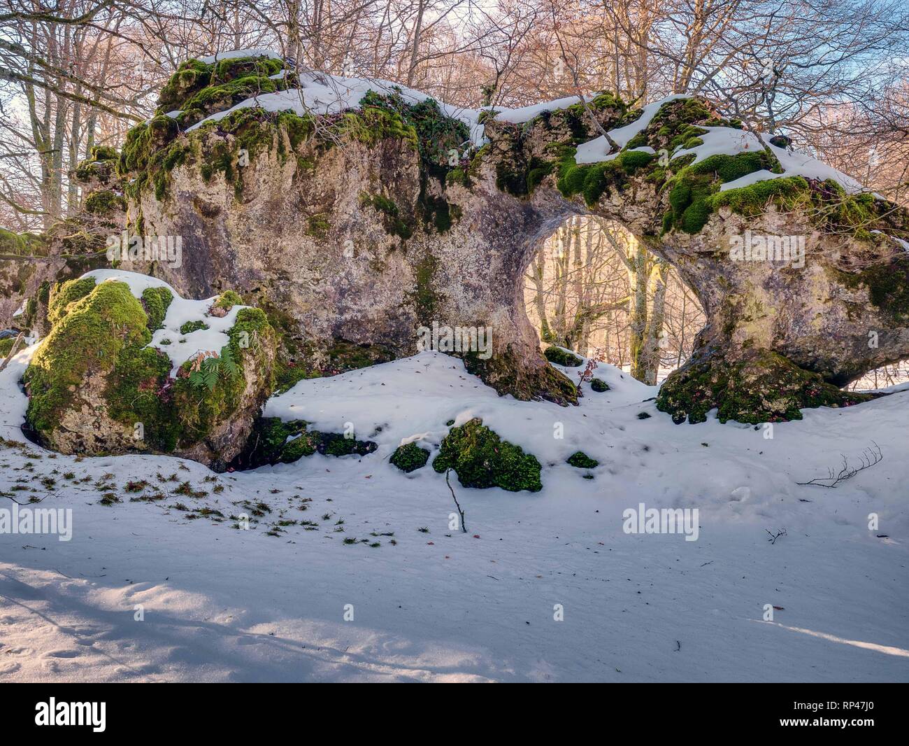 Natural arch "Arco de Zalamportillo" in the Entzia mountain range ...