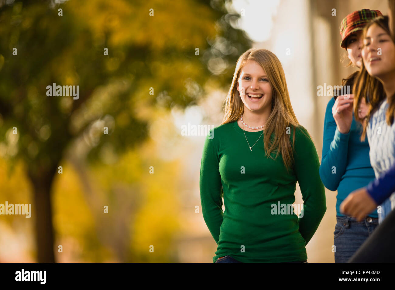 Teen girl left out by friends hi-res stock photography and images - Alamy