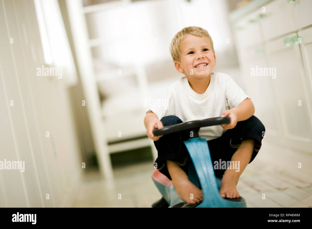 Boy riding in toy car hi-res stock photography and images - Alamy