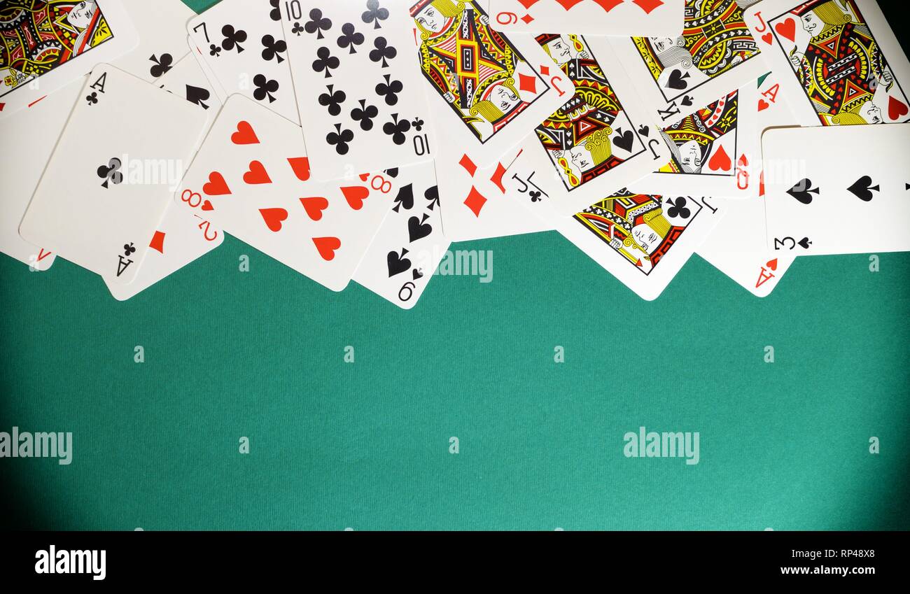 Playing cards are laid out on a table fan Stock Photo - Alamy