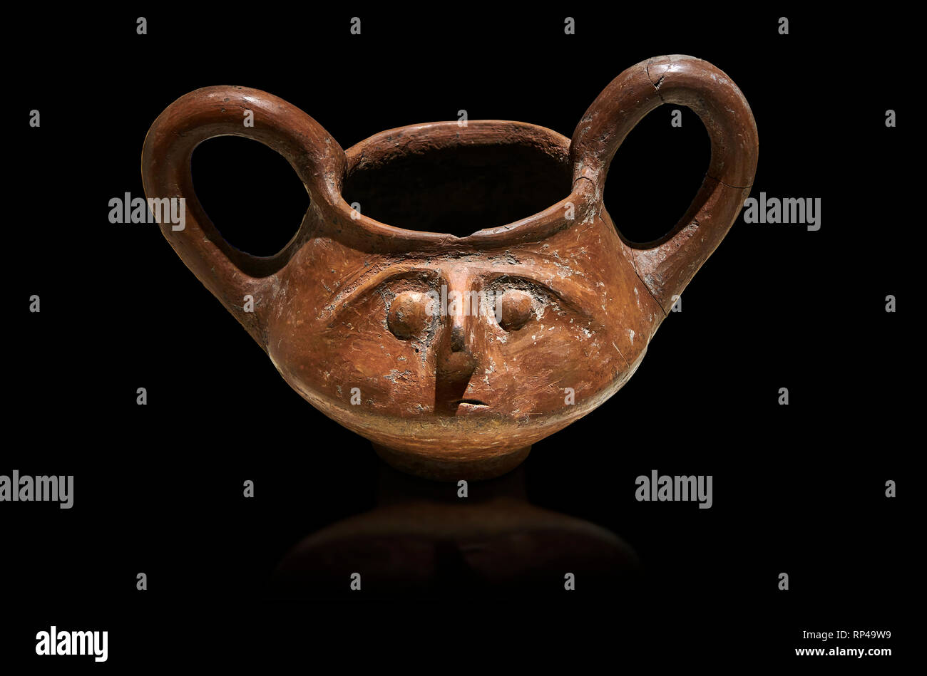 Hittite terra cotta double handled jug with a relief human face- 17th ...