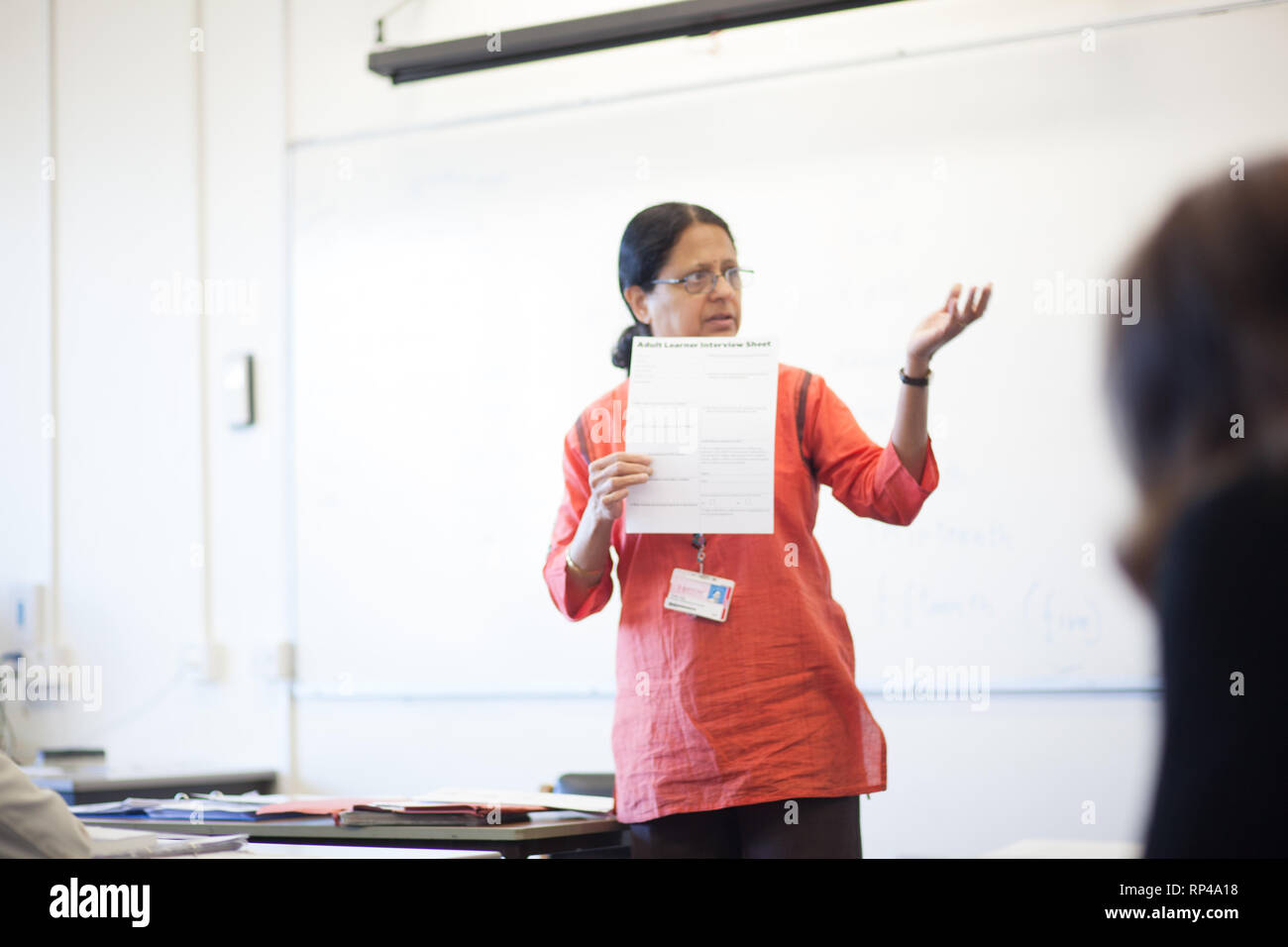 teacher in a classroom teaching ESOL, English for speakers of other ...