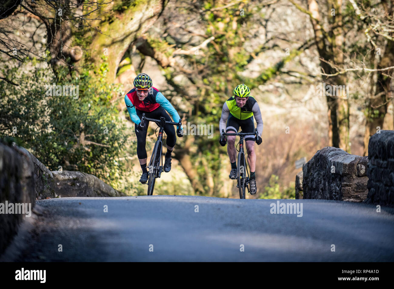 Two cyclists riding on road hi-res stock photography and images - Alamy