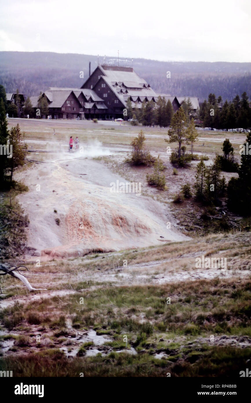 Old Faithful Geyser and surrounding mud pools, Yellowstone Park ...