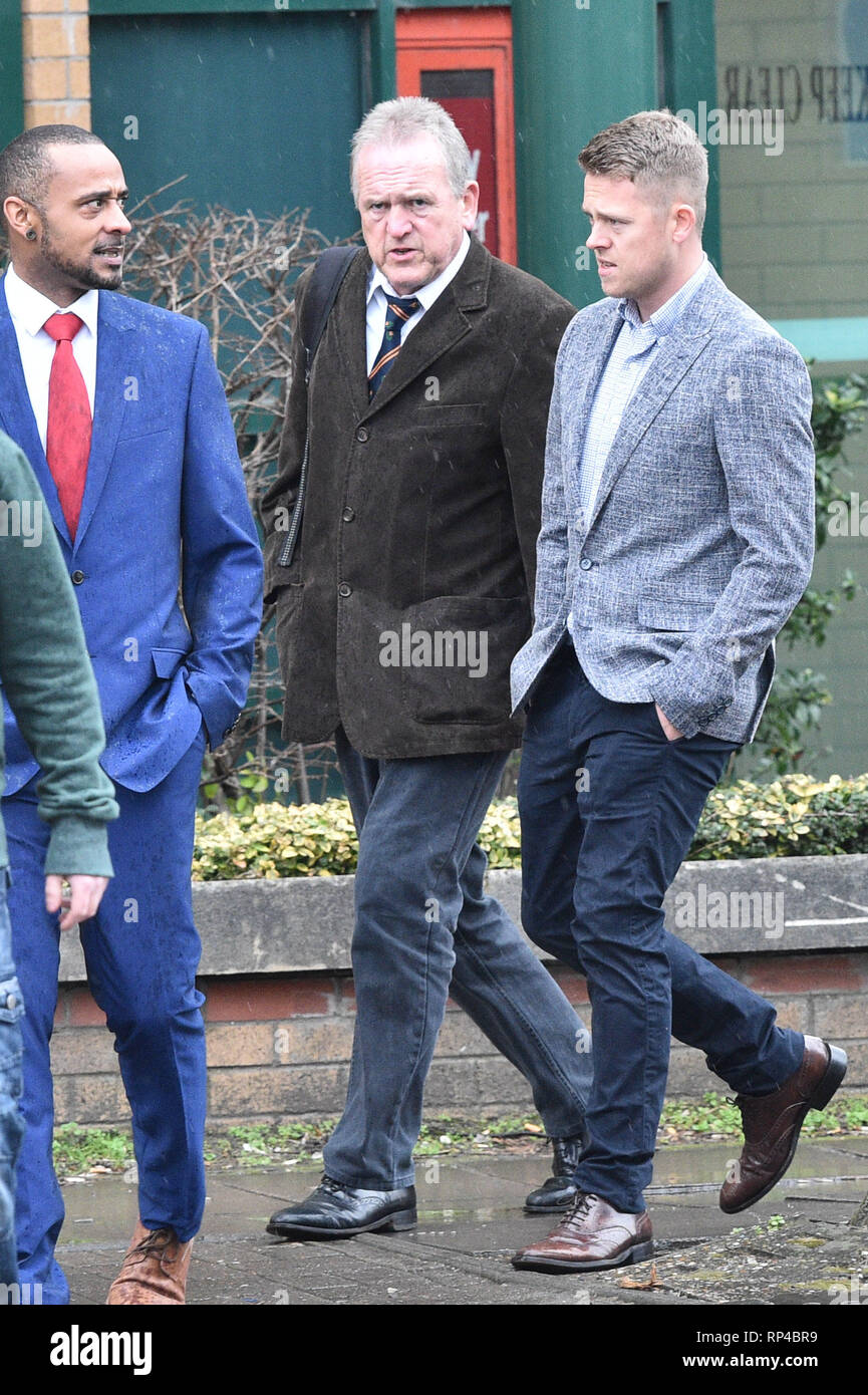 Brian Davies (centre), 62, leaves Cardiff Magistrates' Court where he ...