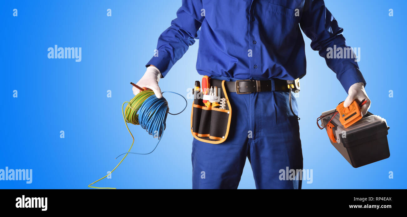 Background with uniformed electrician with tools and electrical ...