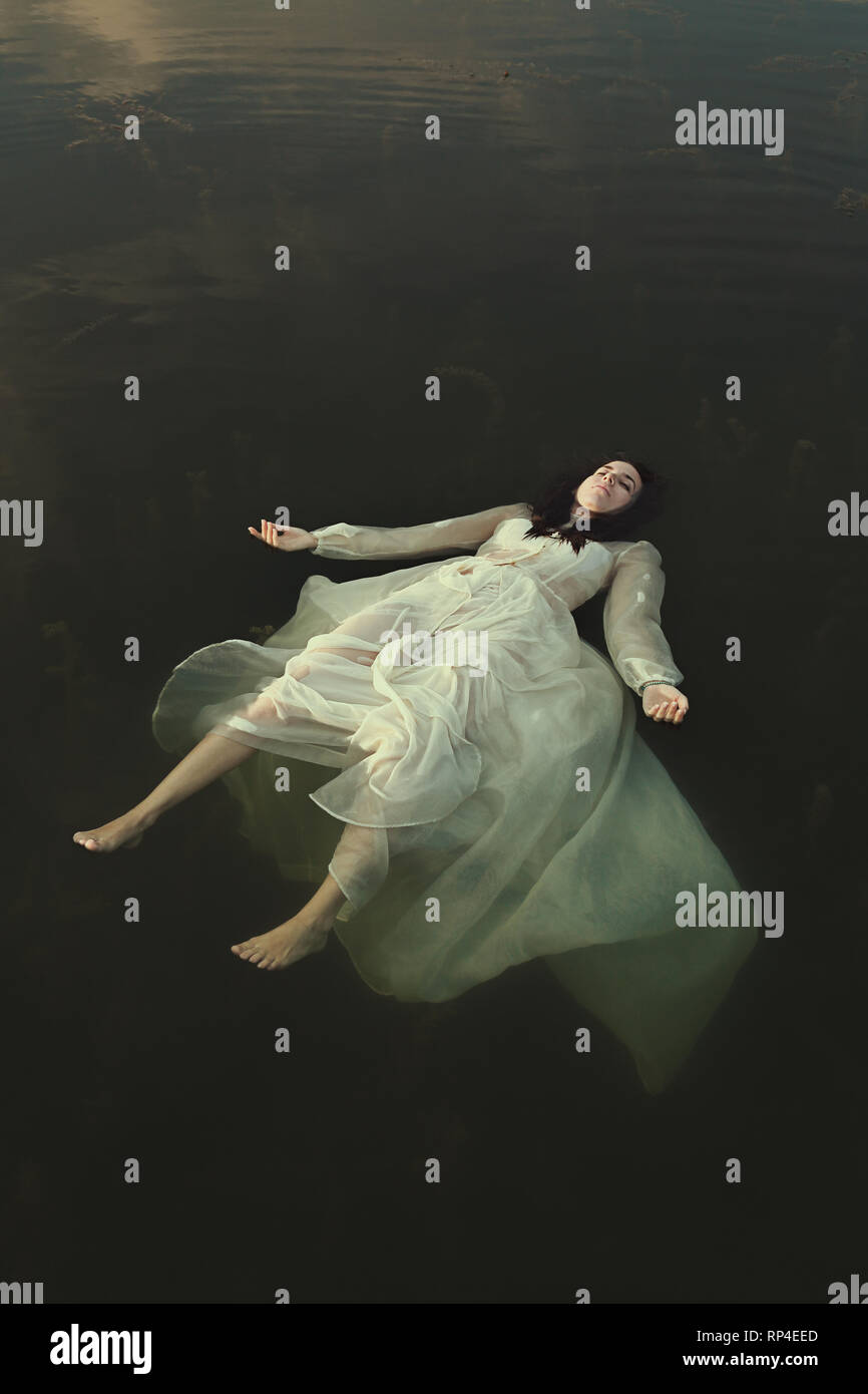 Woman in wet dress floating hi-res stock photography and images - Alamy