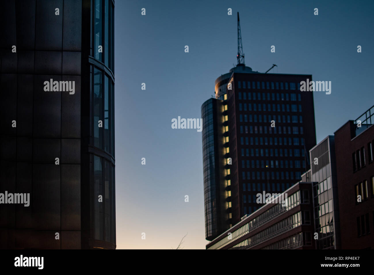 Modern office buildings close up in sunlight. Vintage toned sunset over ...