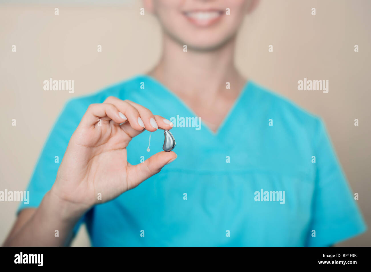 doctors hand holding modern hearing aid for senior people Stock Photo ...