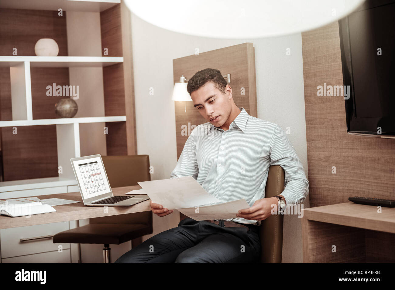 Busy businessman working on schedule for his employees Stock Photo - Alamy