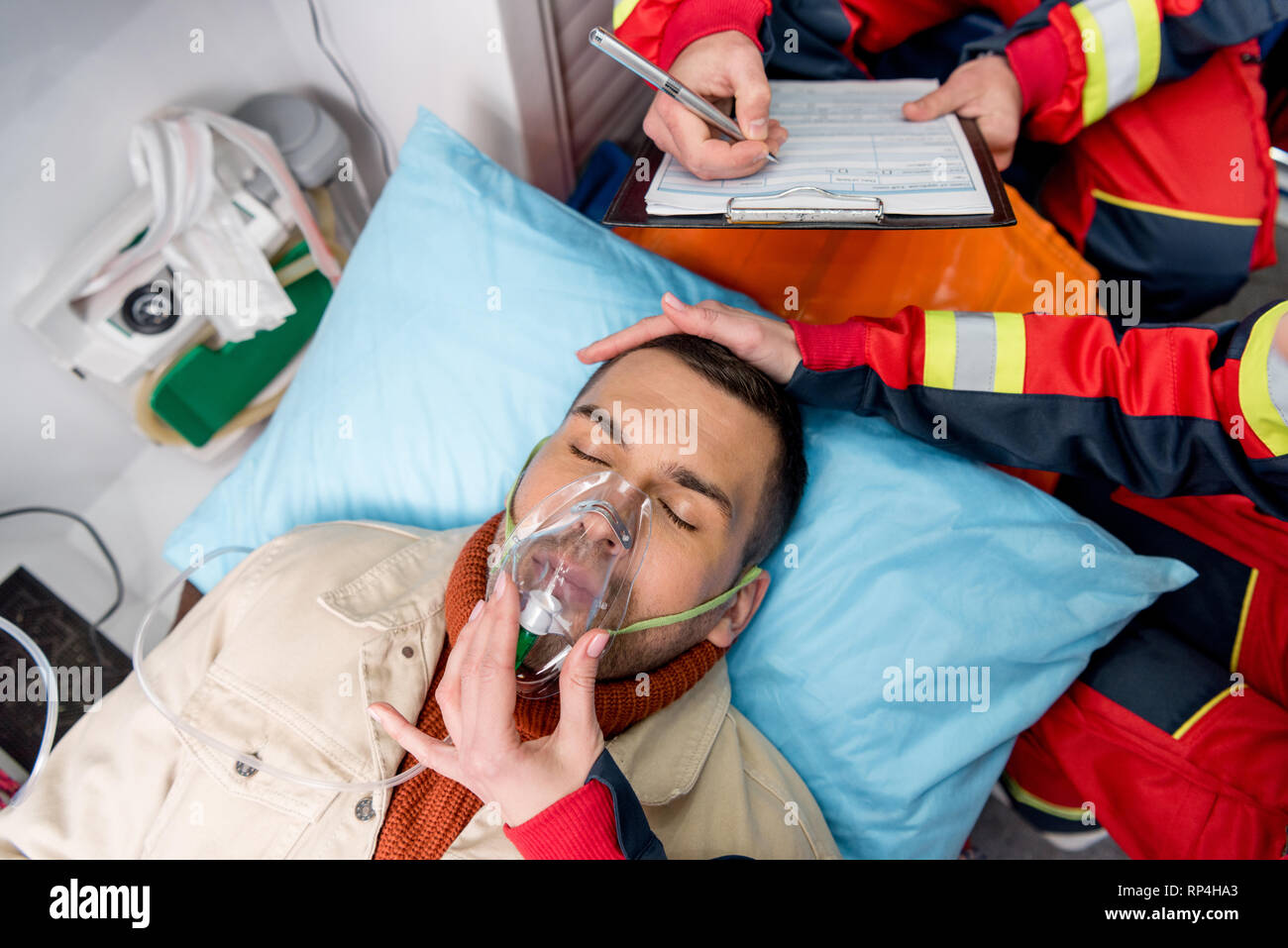 Top view of unconscious patient in oxygen mask Stock Photo - Alamy