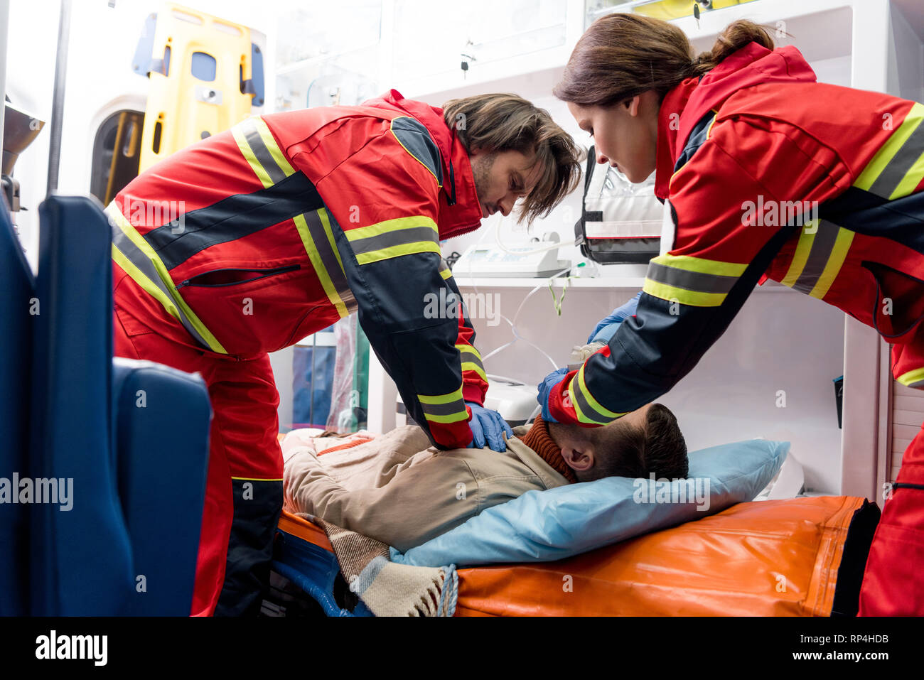 Paramedics in latex gloves doing cardiopulmonary resuscitation Stock Photo - Alamy