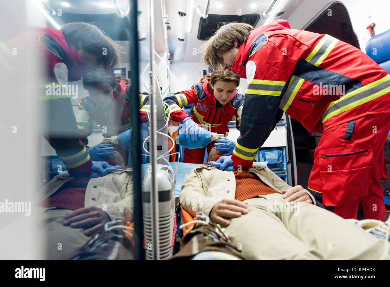 Paramedics doing cardiopulmonary resuscitation in ambulance car Stock Photo - Alamy