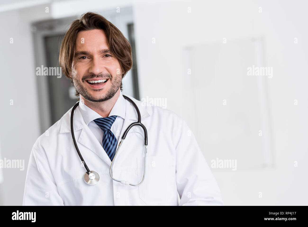 Excited young male doctor hi-res stock photography and images - Alamy