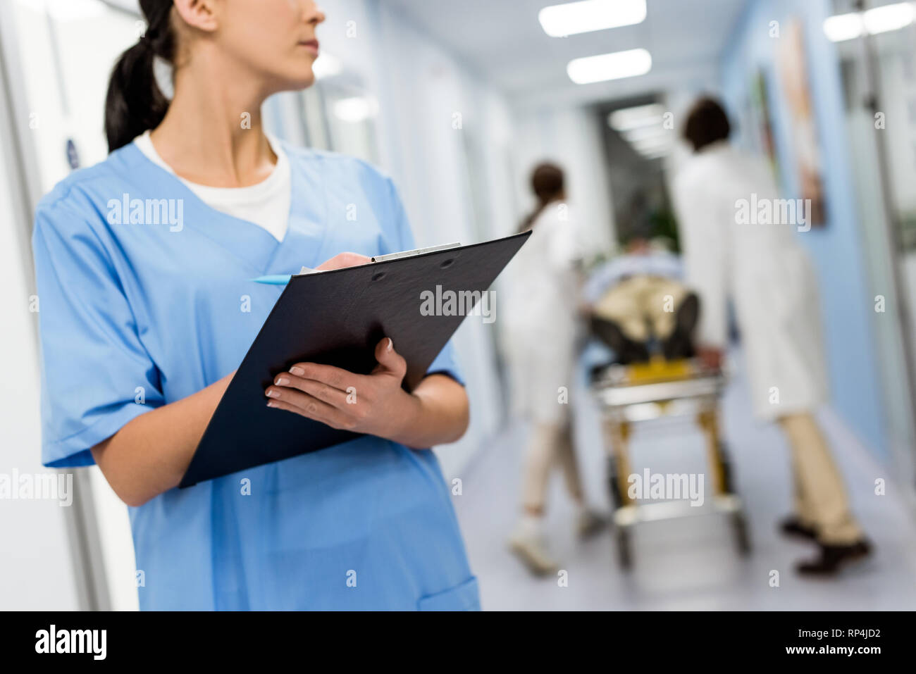 Nurse in blue uniform hi-res stock photography and images - Alamy