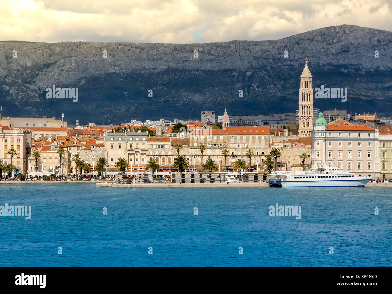 split skyline view with historic downtown while arriving with ferry ...