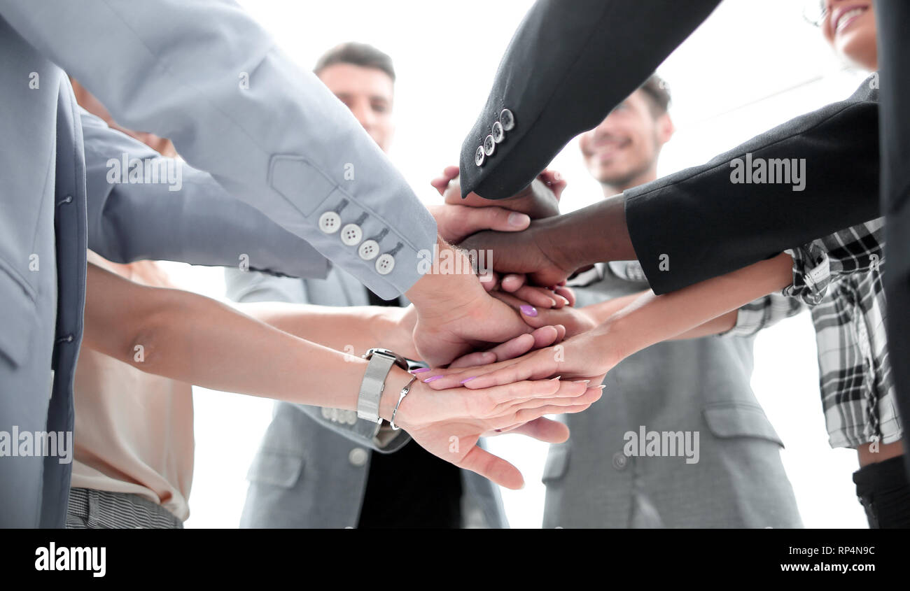 Business people joining hands in circle Stock Photo - Alamy