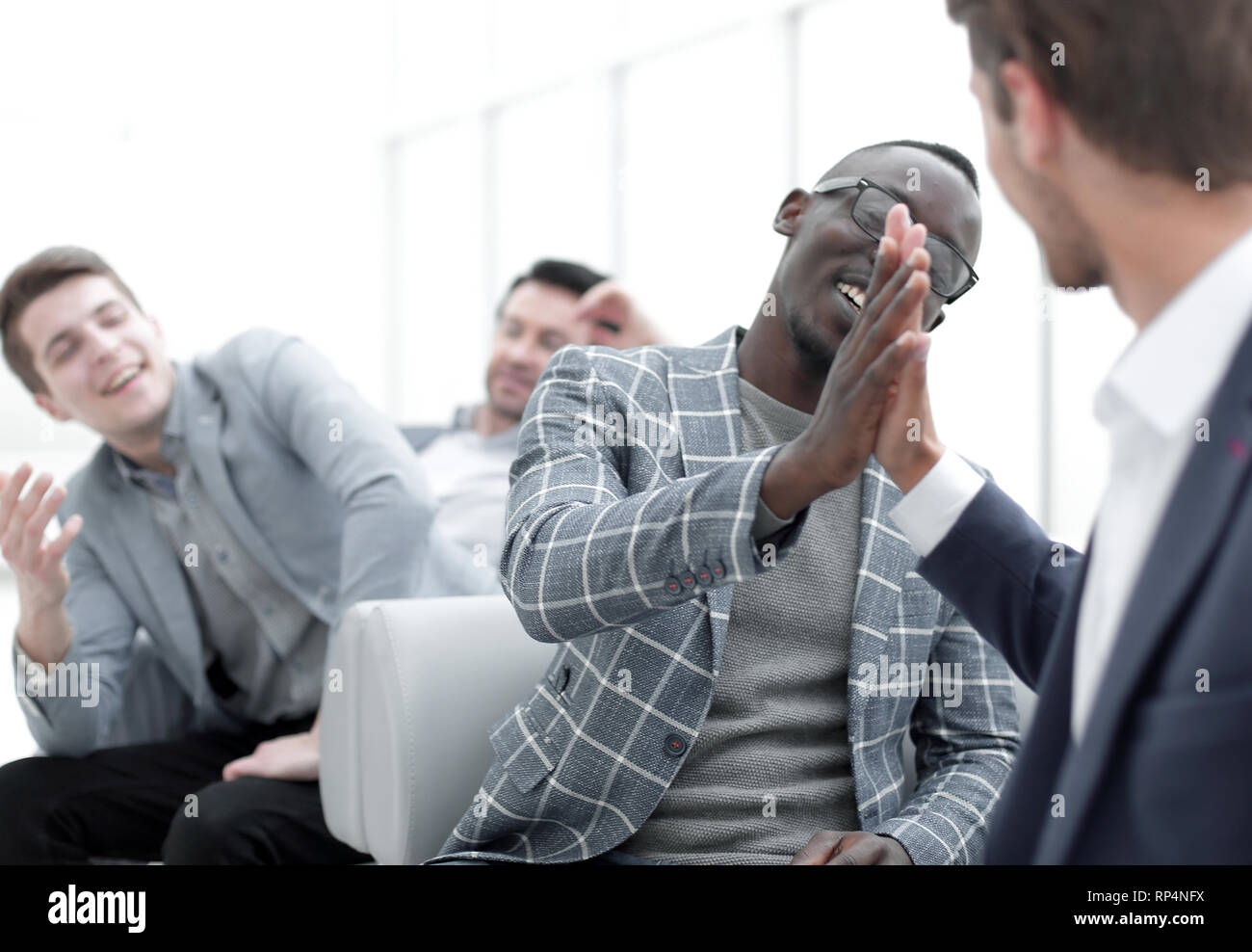 business people giving each other high five Stock Photo - Alamy