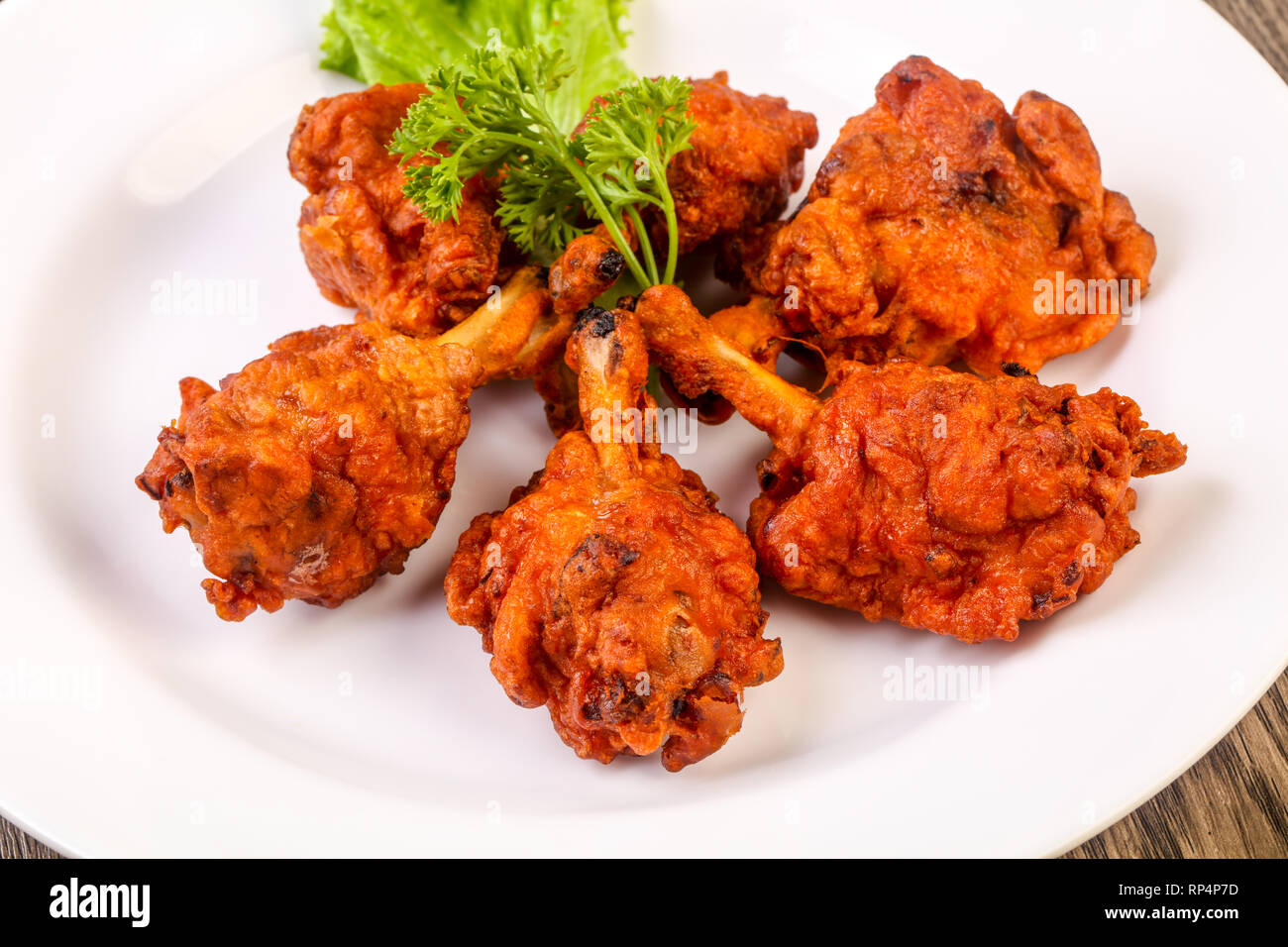 Indian traditional cuisine - Chicken lollipops with spices Stock Photo ...