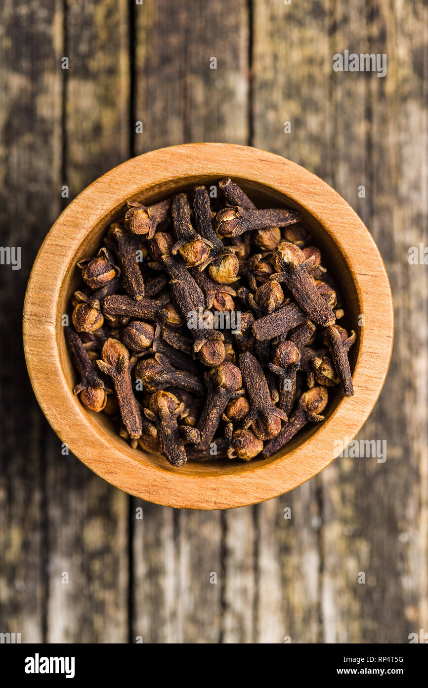 Carnation, dried clove spice in bowl Stock Photo - Alamy