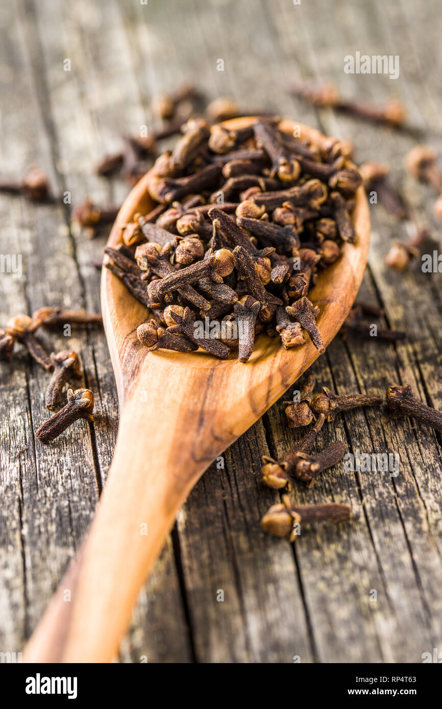 Carnation, dried clove spice in wooden spoon Stock Photo - Alamy