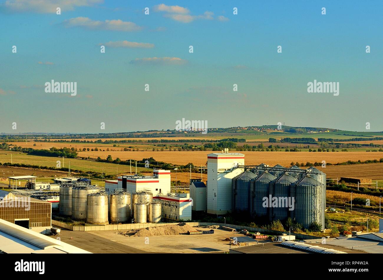 Aerial view of modern factory. Modern plant with blue sky. Steel ...