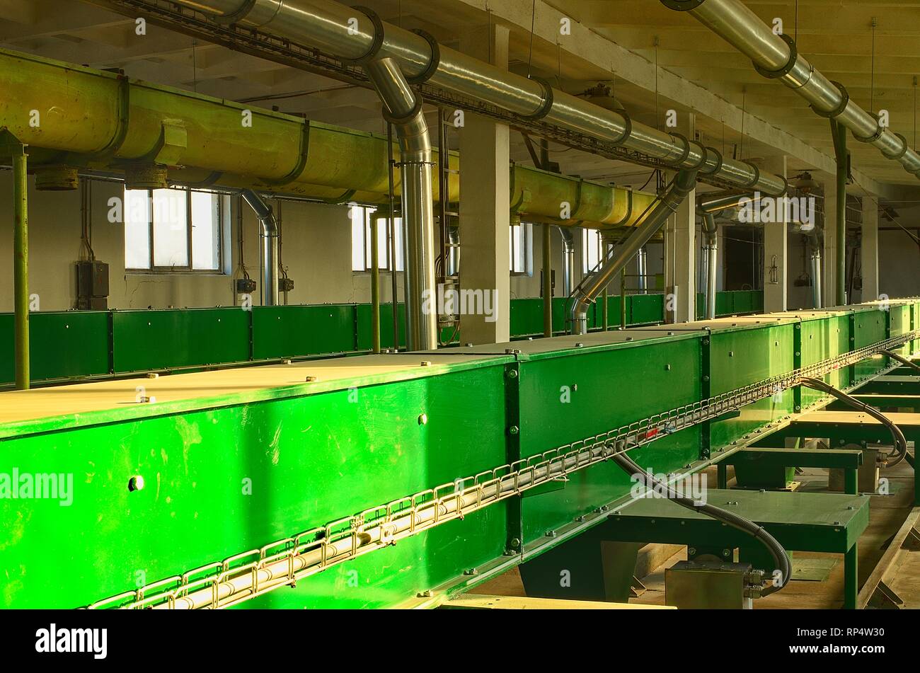 Factory interior. Conveyor crops. Chain conveyor grain. Industrial ...
