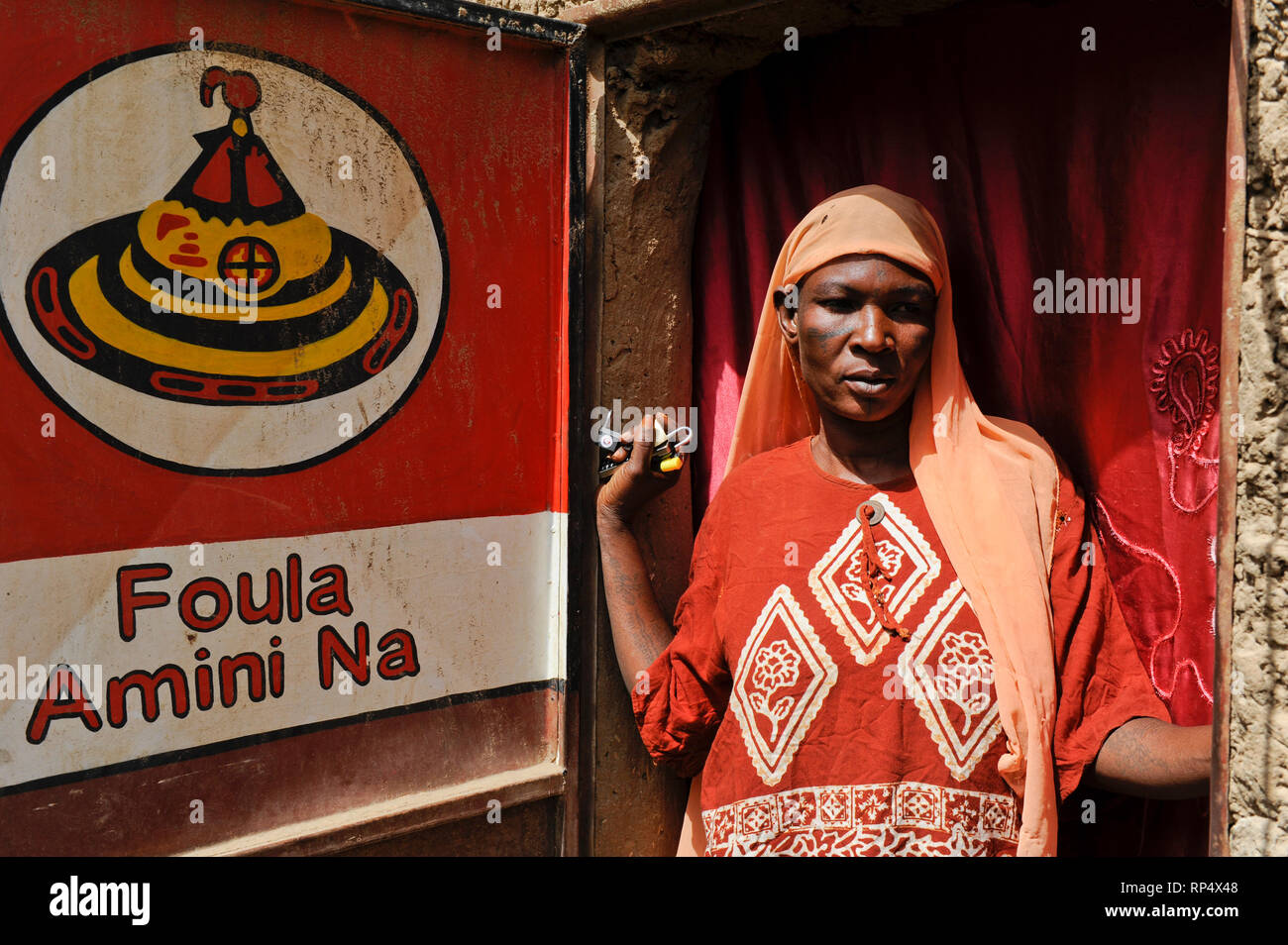 NIGER Maradi, prostitute Champa, at her door a advertisement for Foula ...