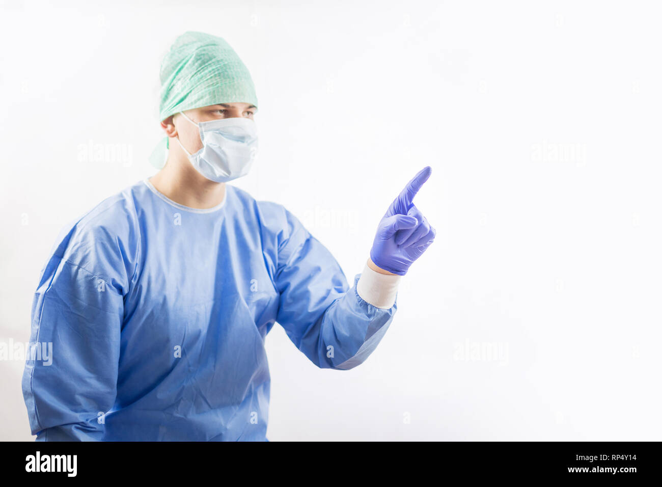 Surgeon Doctor In Sterile Gloves Preparing For Operation In Hospital