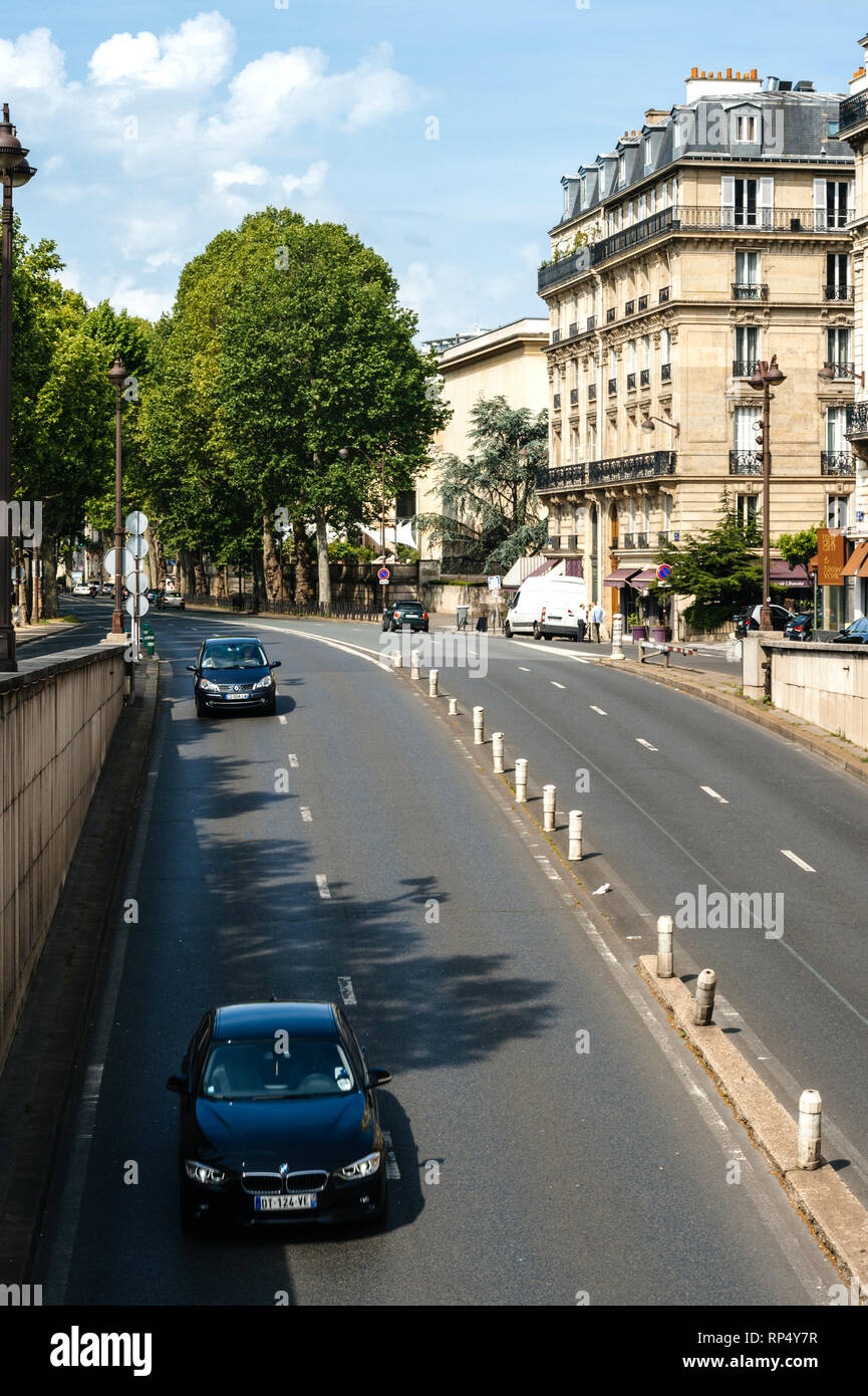 PARIS, FRANCE - MAY 21, 2016: Fast cars entering and exiting the Avenue ...
