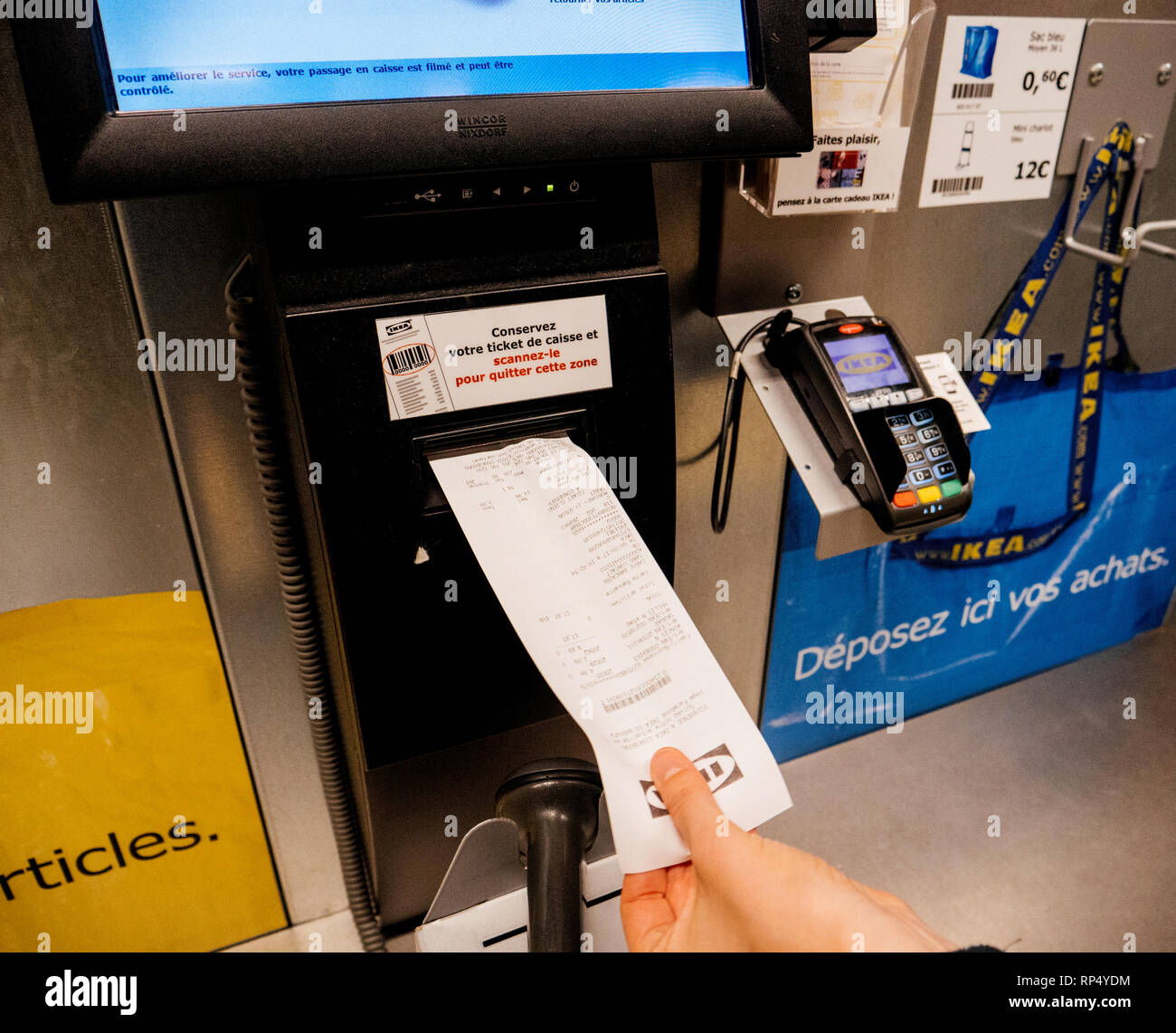 PARIS, FRANCE - SEP 2, 2017: Young woman taking receipt at the sef ...