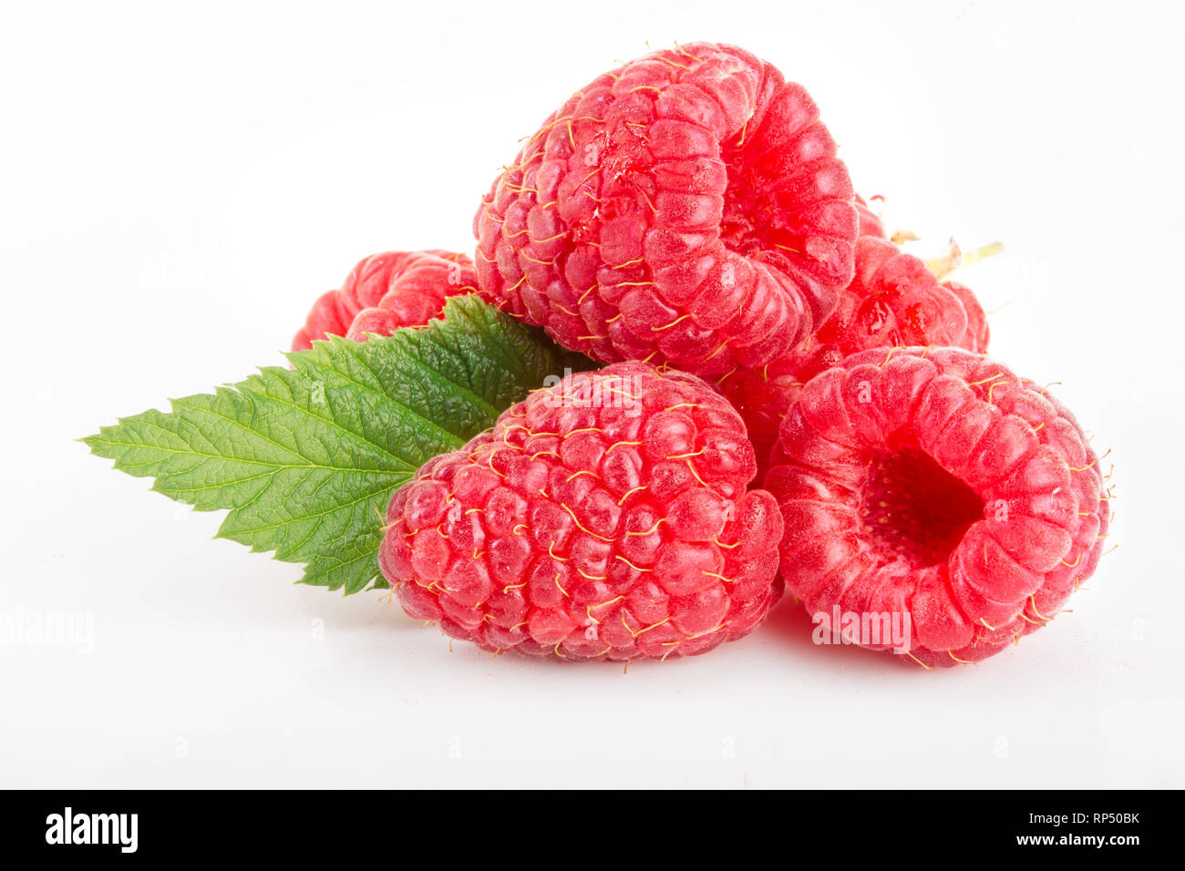 Raspberry isolated on white background. Pile or heap Stock Photo - Alamy