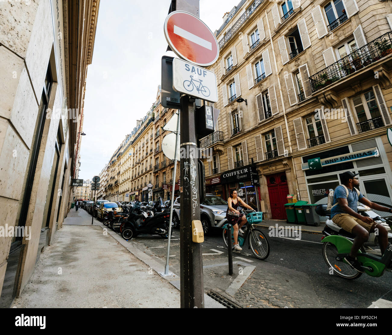 PARIS, FRANCE - OCT 13, 2018: View from the street of people on scooter ...