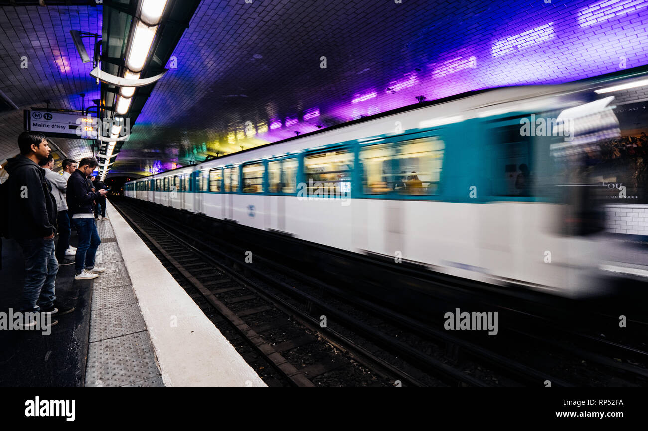 PARIS, FRANCE - OCT 13, 2018: Fast train passing as people waits to ...