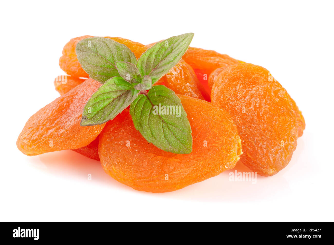 Dried apricots with mint leaves isolated on white background Stock ...