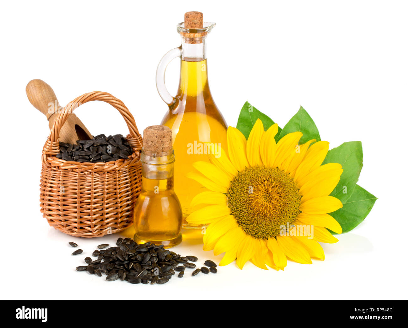 Sunflower oil, seeds and flower isolated on white background Stock ...