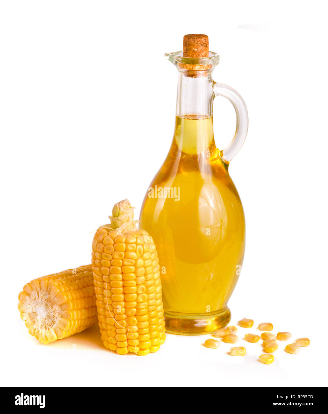 Corn oil in decanter, fresh corn cobs and grains isolated on white ...