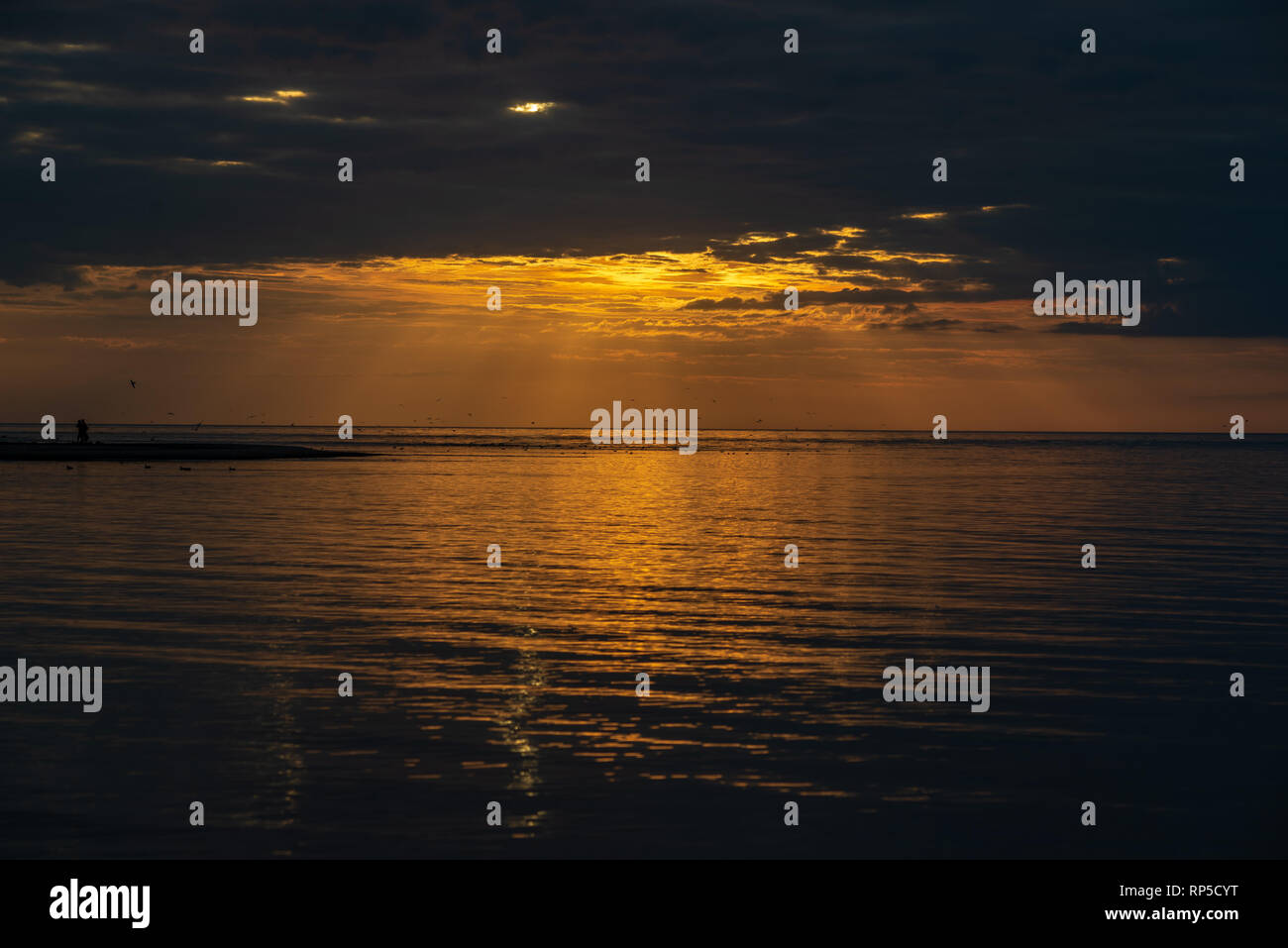 colorful sunset on the sea beach in summer with clean sky and calm ...
