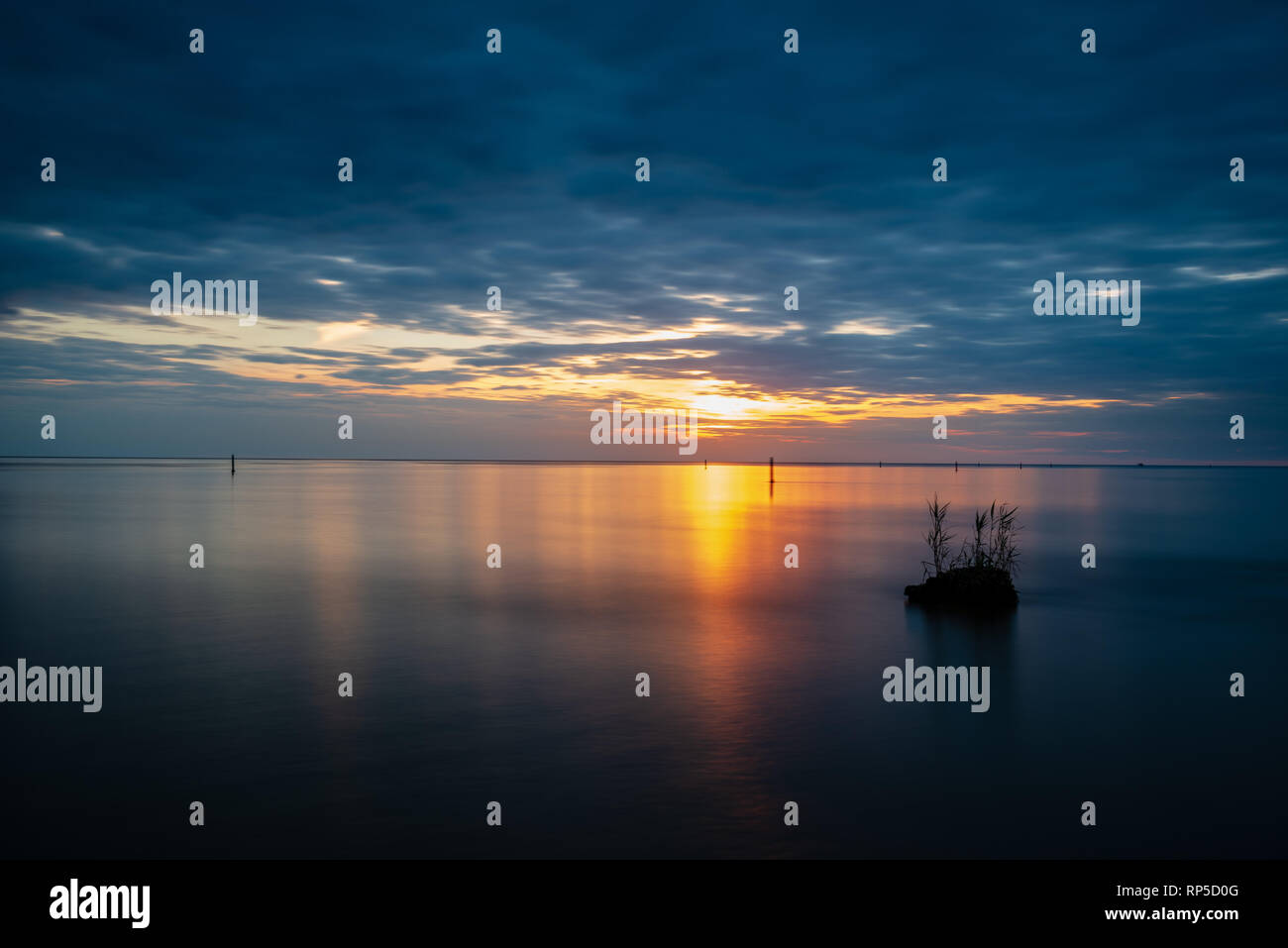 colorful sunset on the sea beach in summer with clean sky and calm ...