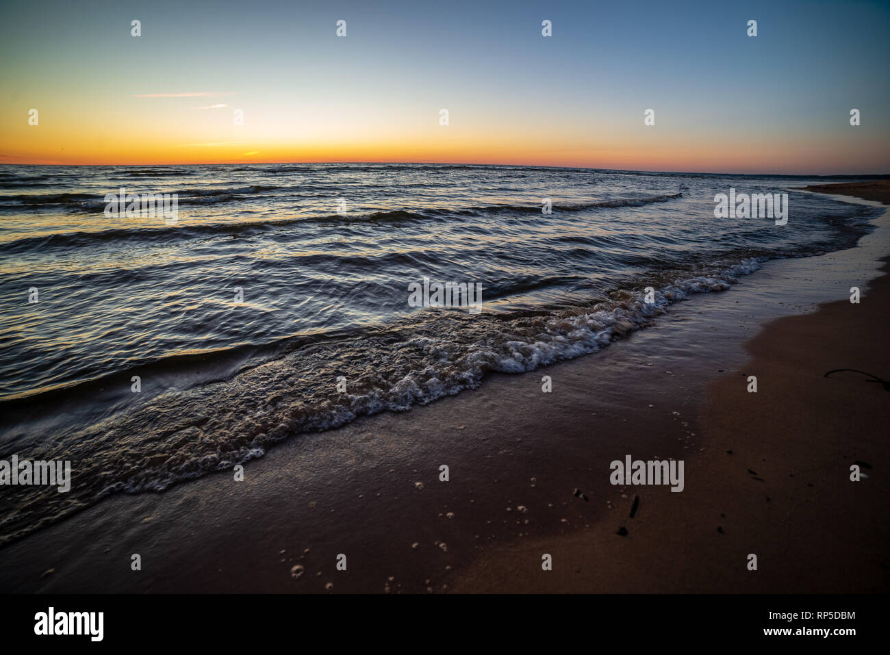 colorful sunset on the sea beach in summer with clean sky and calm ...
