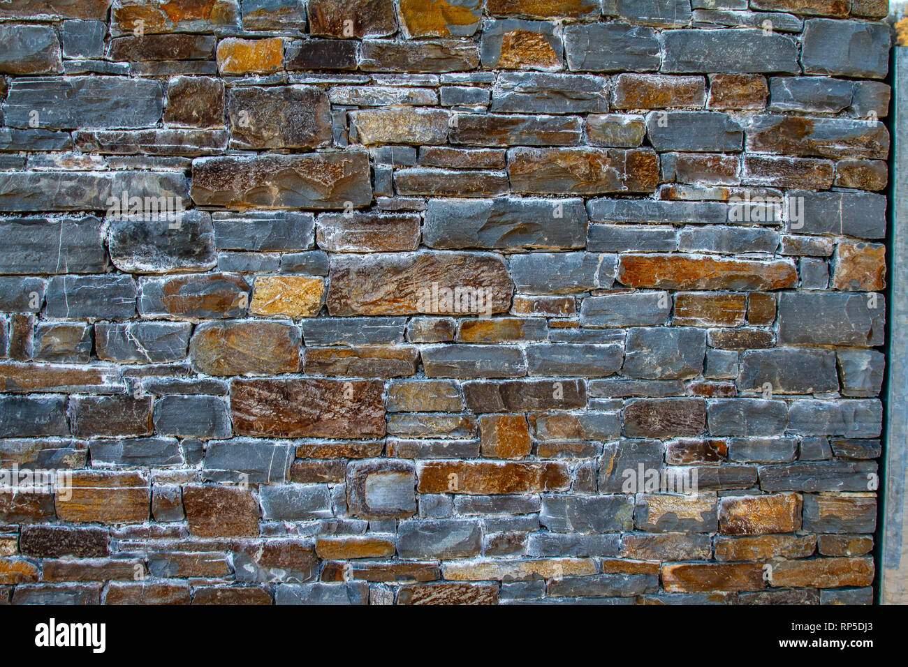 wall of trap rock in grey and brown Stock Photo - Alamy