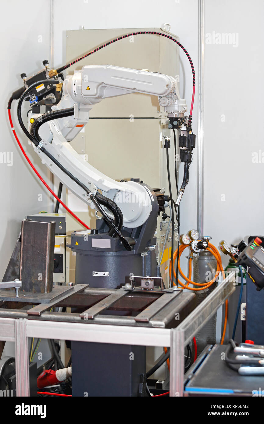 Robotic Arm Welding Parts in Metal Factory Production Stock Photo - Alamy