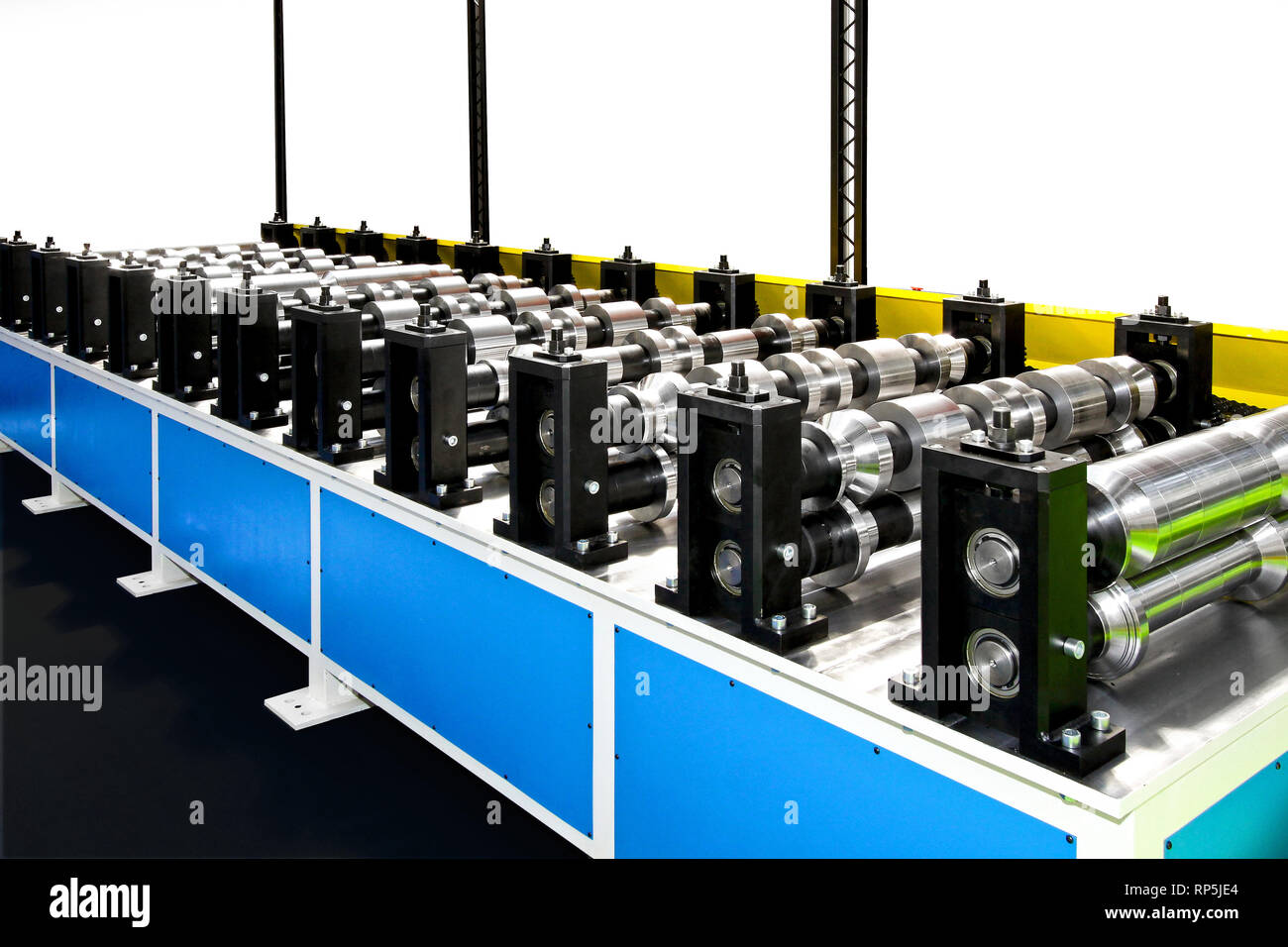 Long line of steel rollers in factory Stock Photo - Alamy