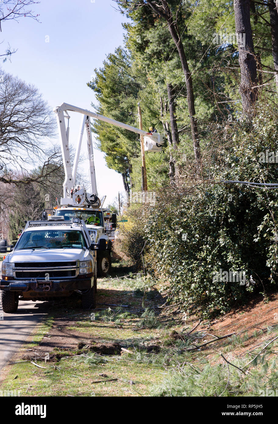 Crew repairing down power line Stock Photo - Alamy