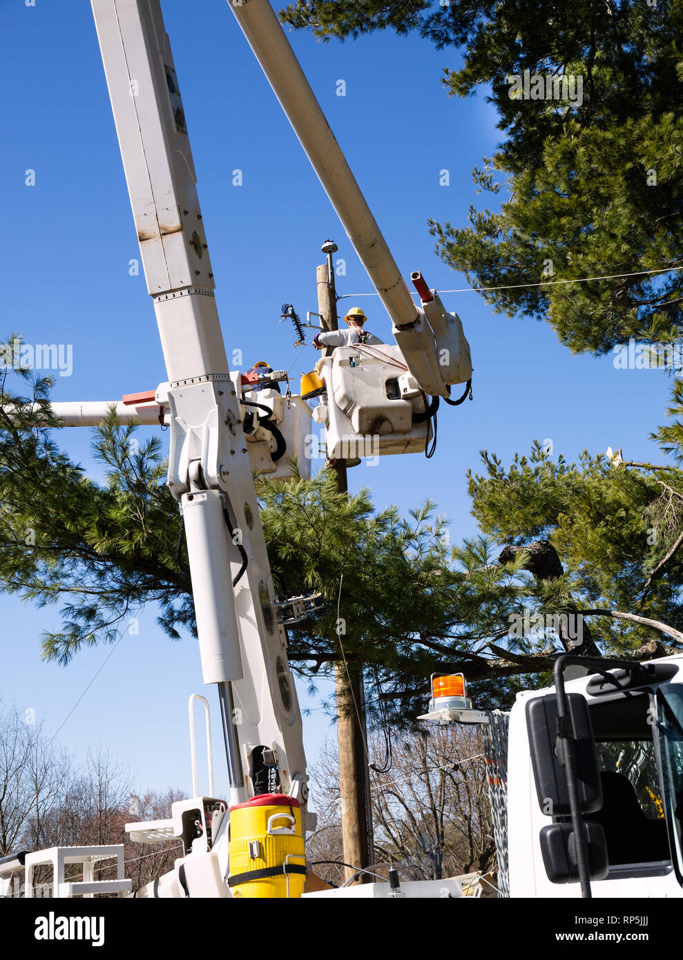 Repairman fixing down power lines Stock Photo - Alamy