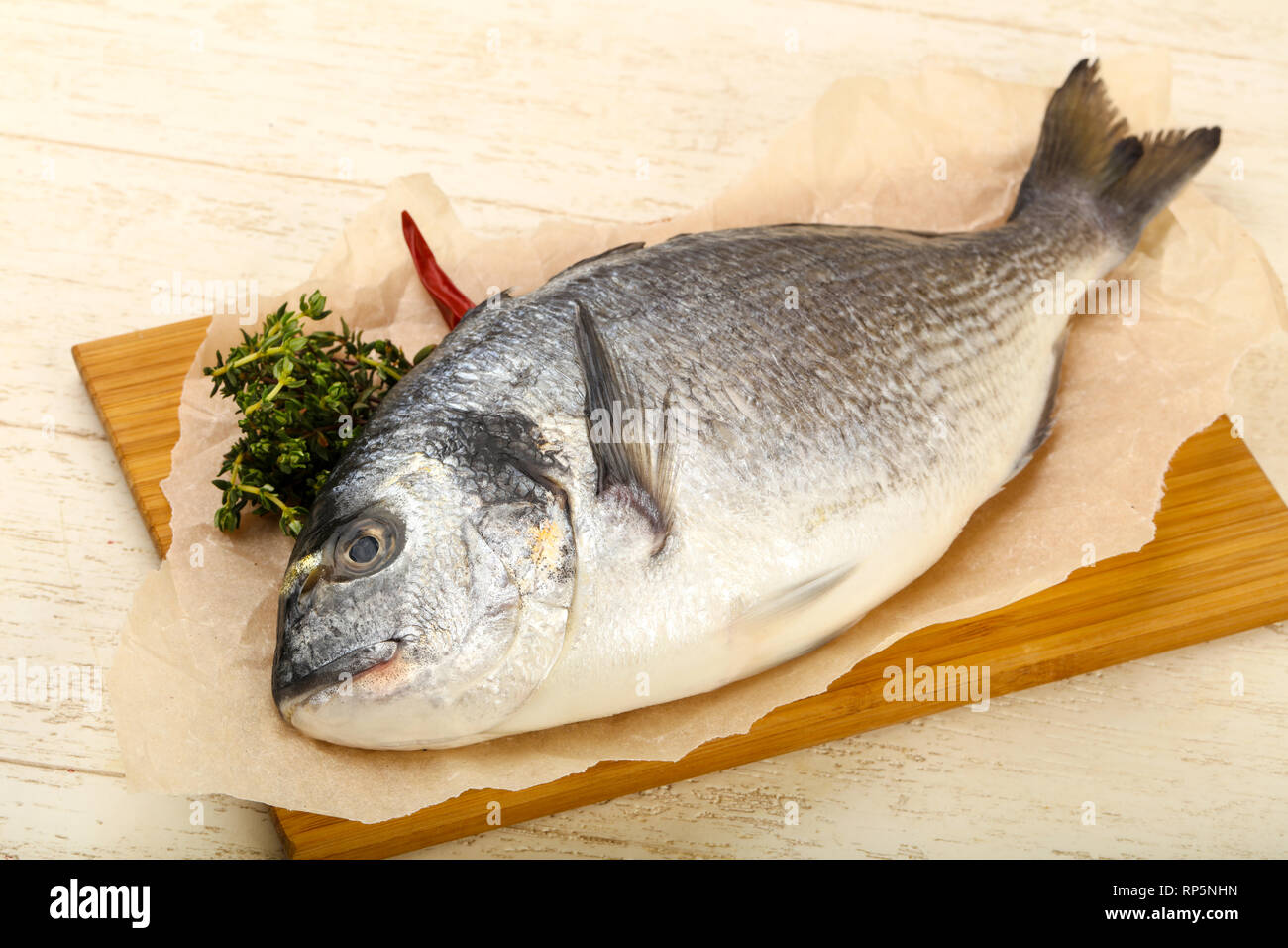 raw dorada fish - ready for cooking Stock Photo - Alamy