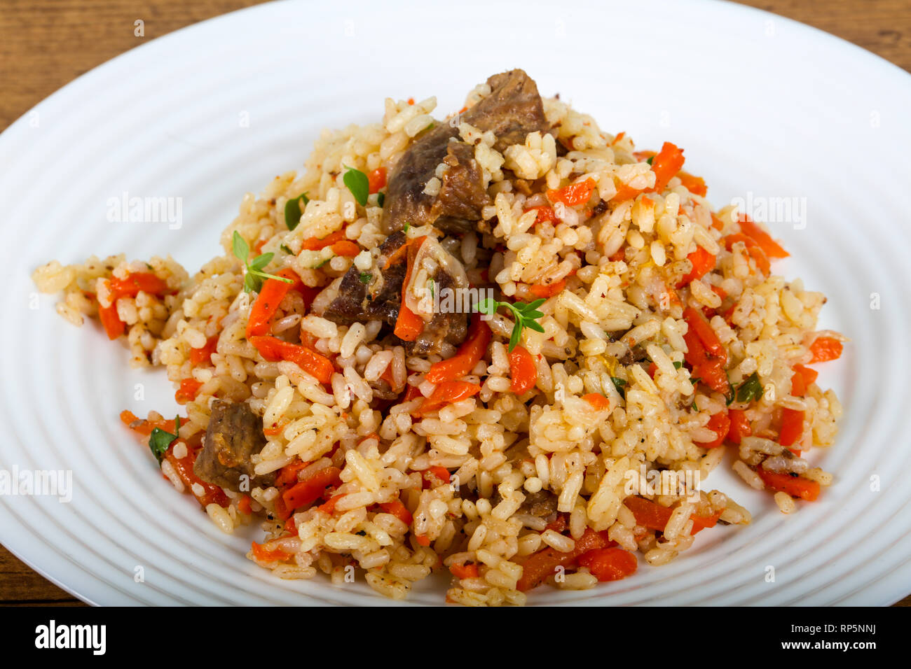 Asian rice - Plov with meat and carrot Stock Photo - Alamy
